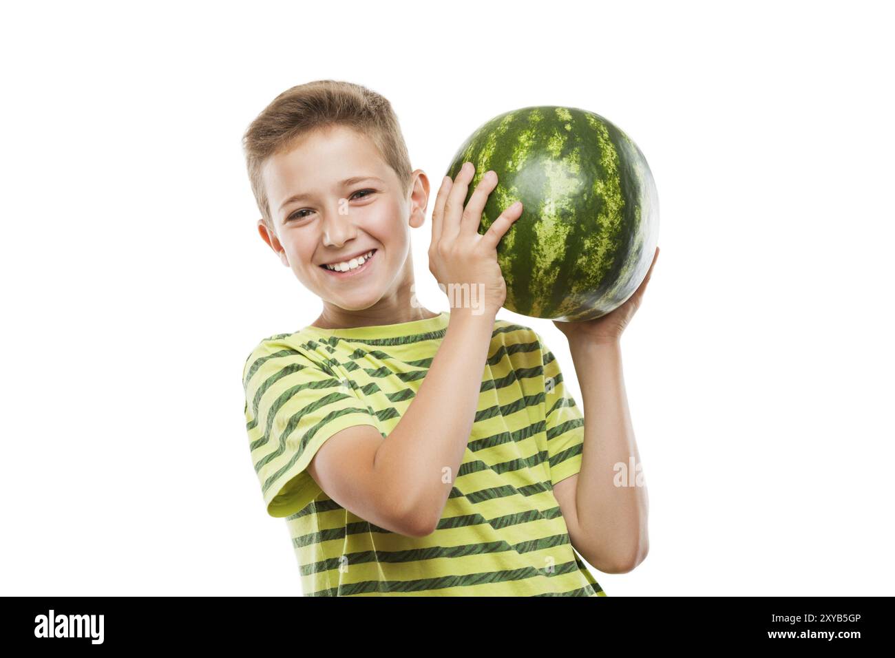 Handsome smiling child boy hand holding green ripe watermelon fruit ...