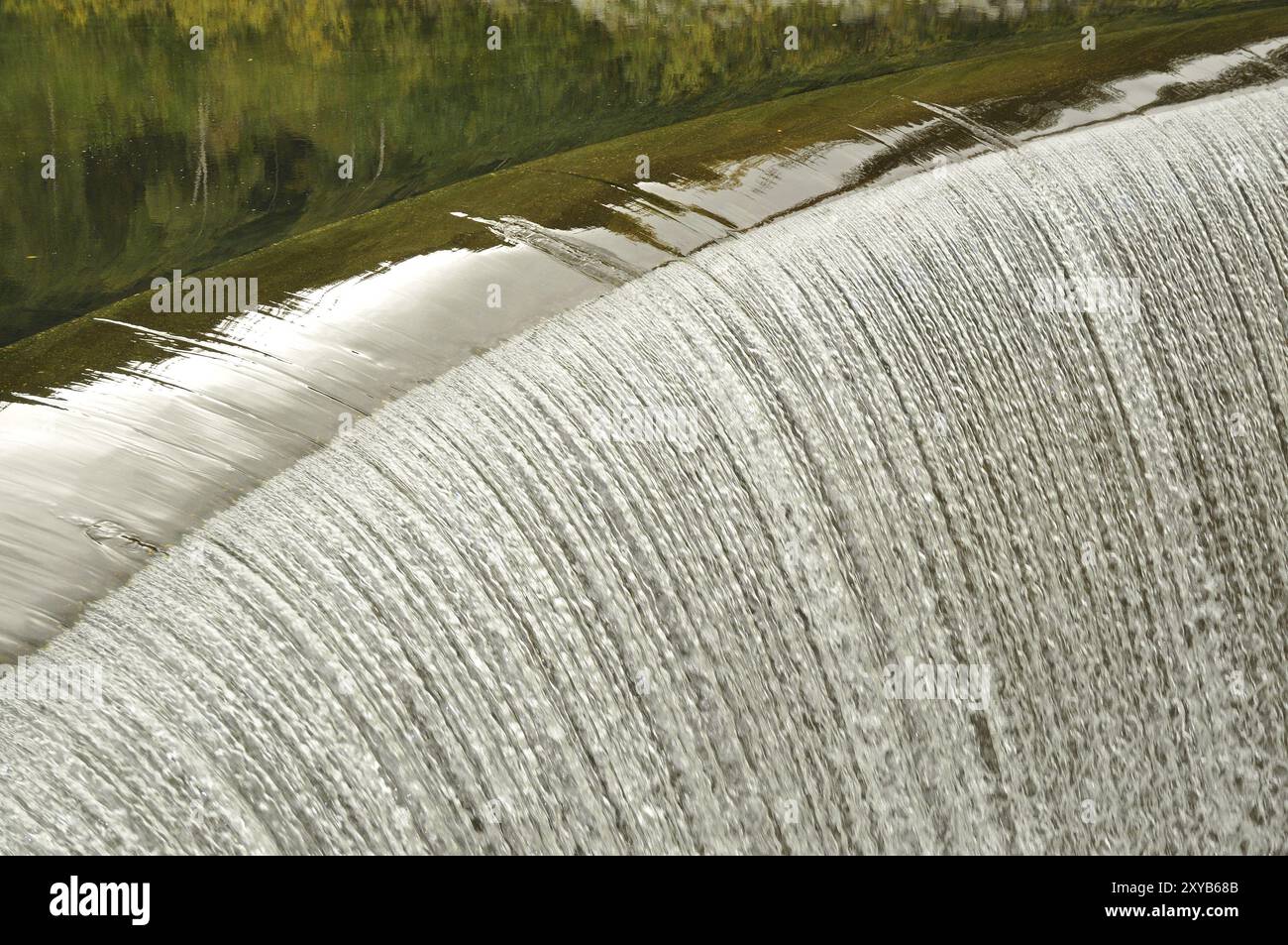 Falling down water from a weir Stock Photo - Alamy