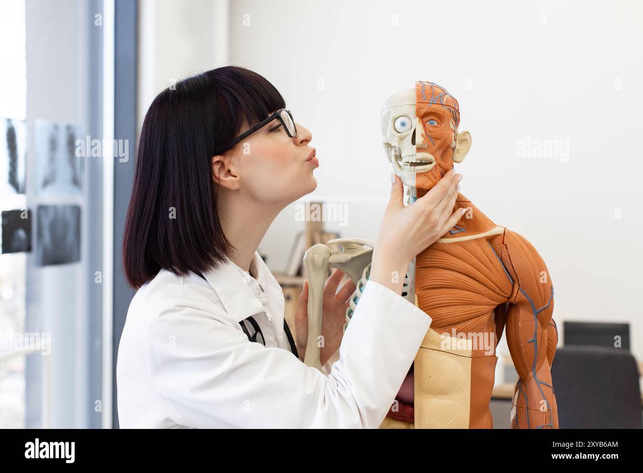 Medical student examining anatomical mannequin in classroom Stock Photo ...