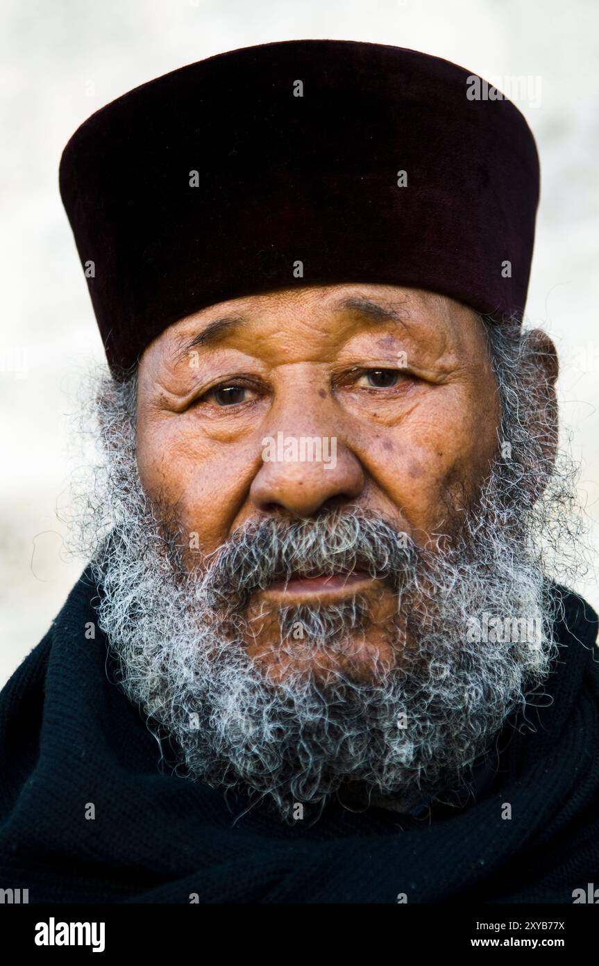 Portrait of an Ethiopian Orthodox priest sitting by Damascus gate in ...