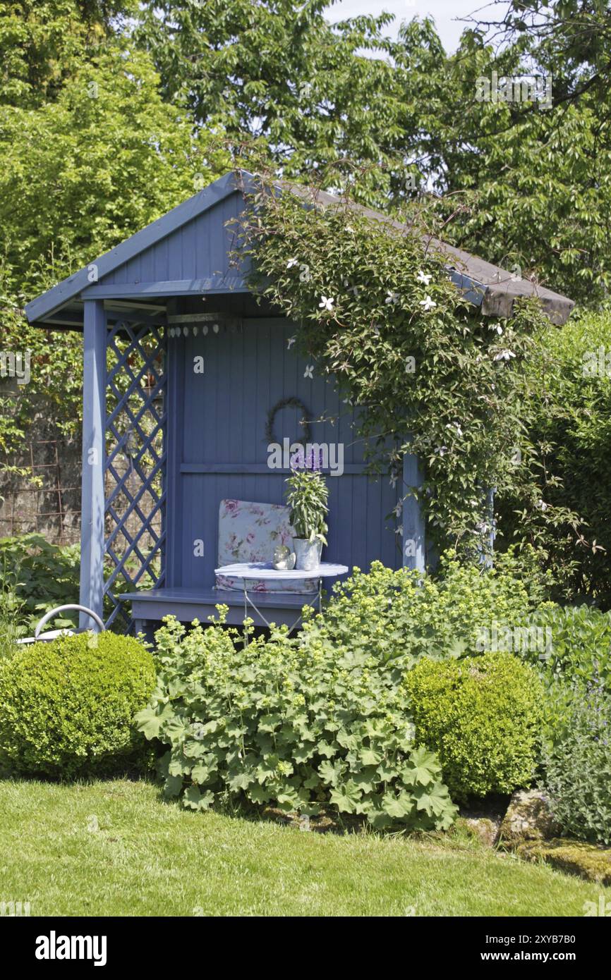 Garden with blue garden shed Stock Photo - Alamy