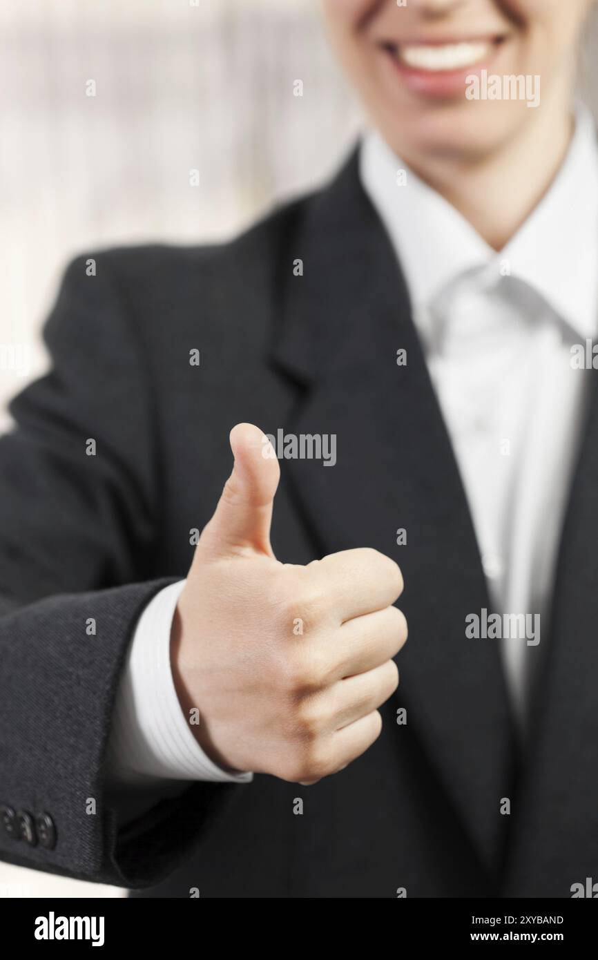 Business women hand gesture thumb up success sign Stock Photo - Alamy