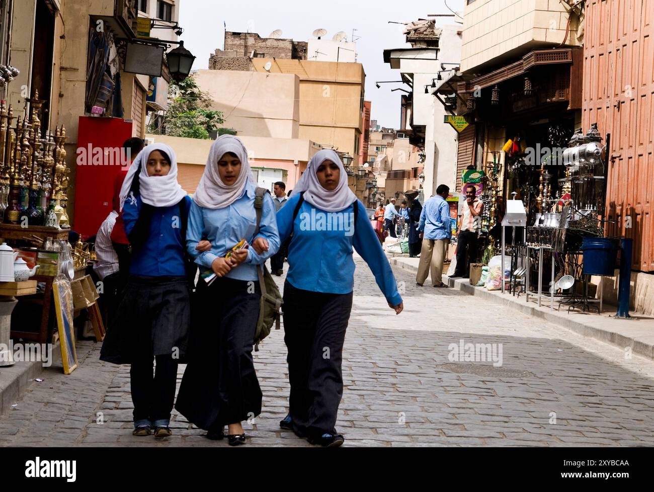 School children walk home by the water pipe shops in Cairo Stock Photo - Alamy