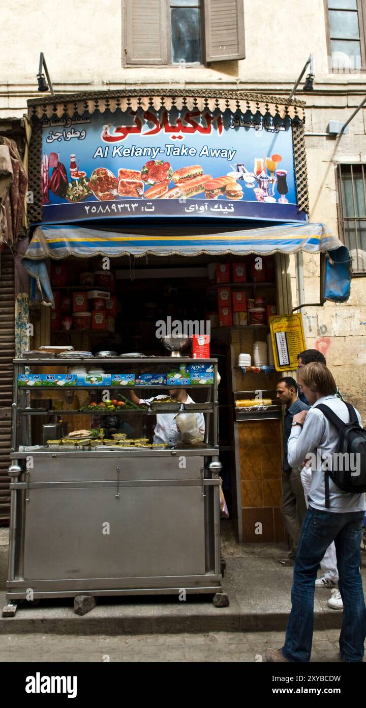 Tourist buy snacks at Al Kelany snack shop in the Khan El Khalili market in Cairo, Egypt Stock ...
