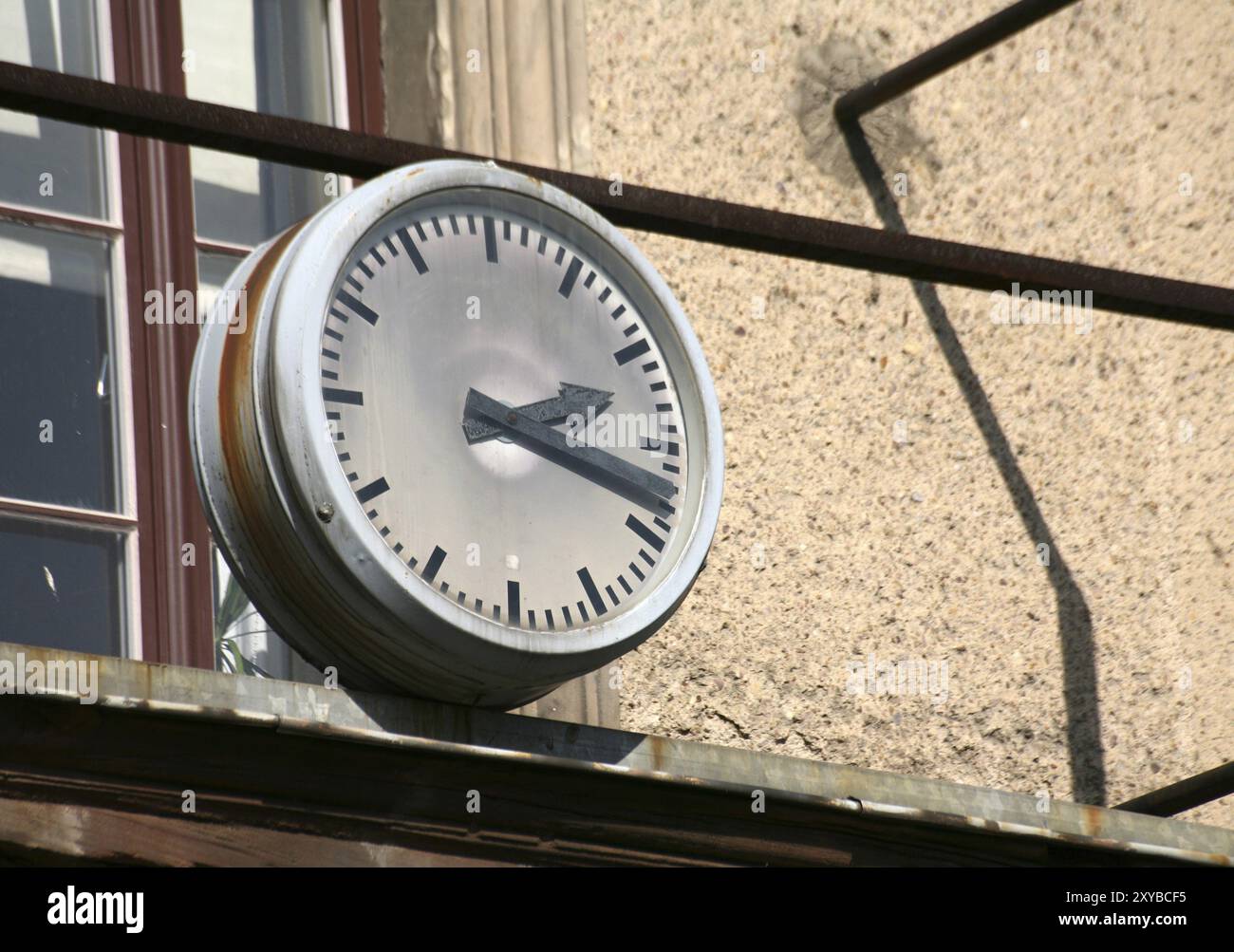 Rotten clock on a dilapidated school building Stock Photo - Alamy