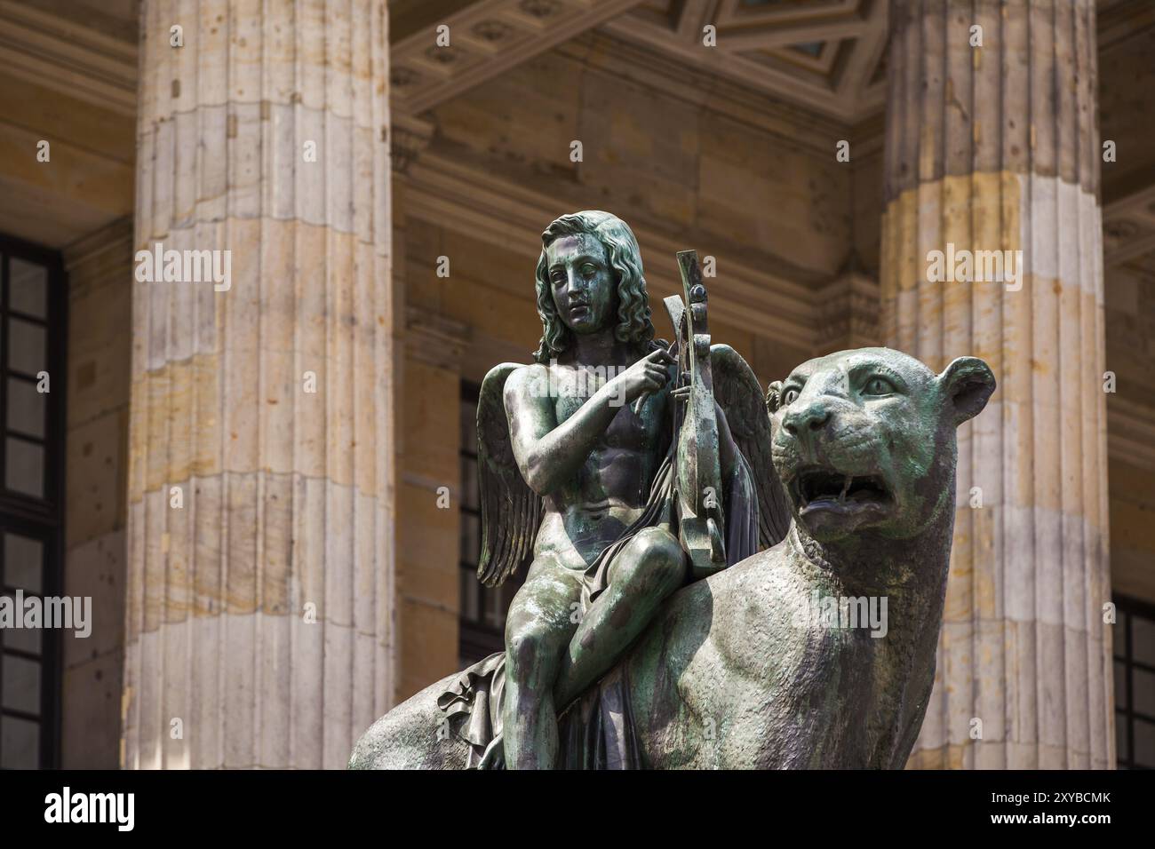 Close-up of an angel riding a lioness and playing the harp, with the ...