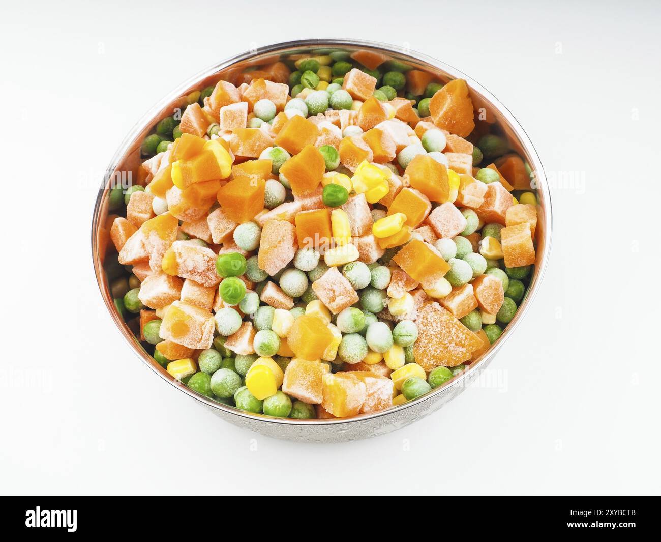 Frozen carrots, maize and peas, thawing in a steel bowl Stock Photo - Alamy
