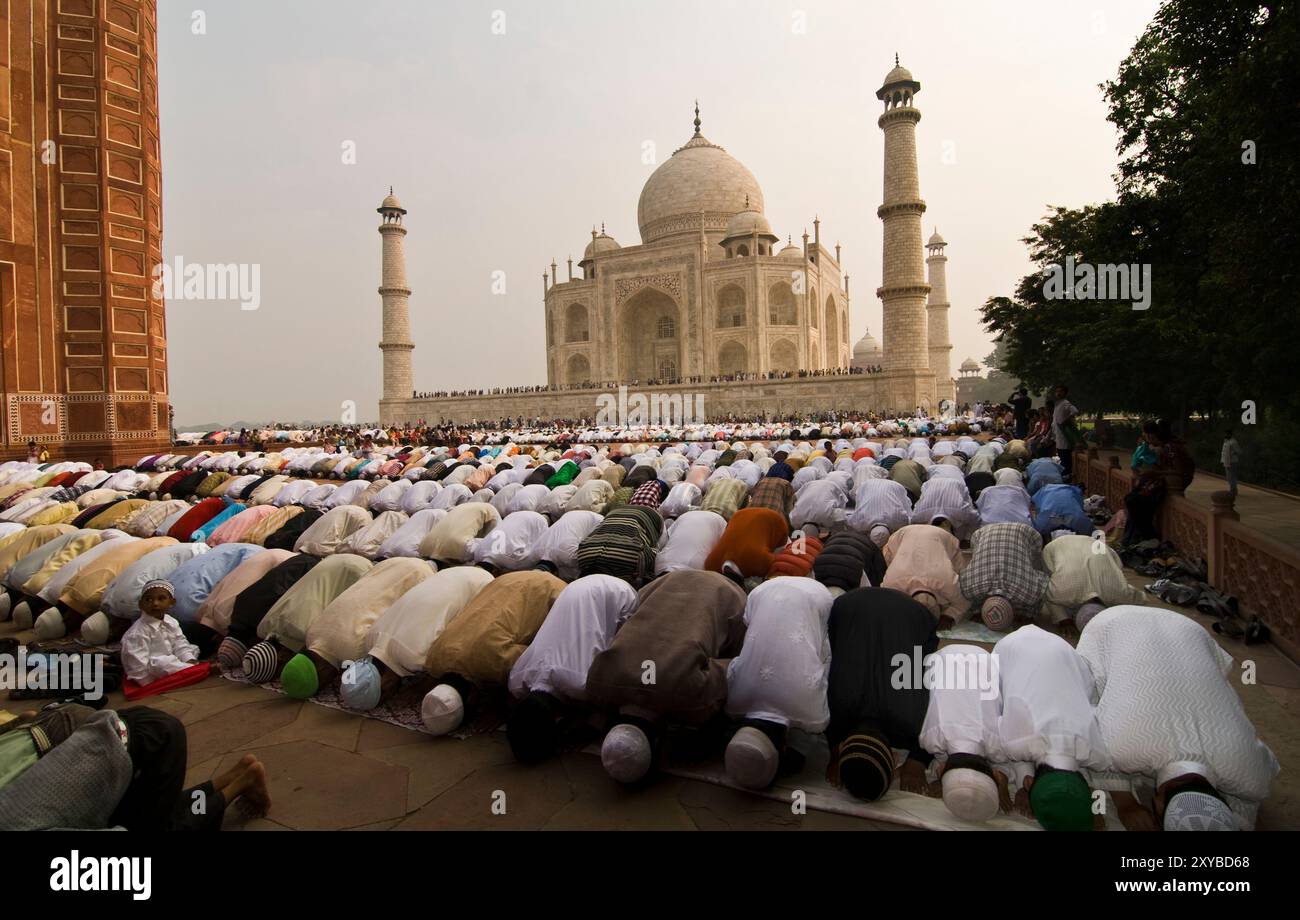 Muslim men pray by the mosque next to the Taj Mahal in Agra, India ...