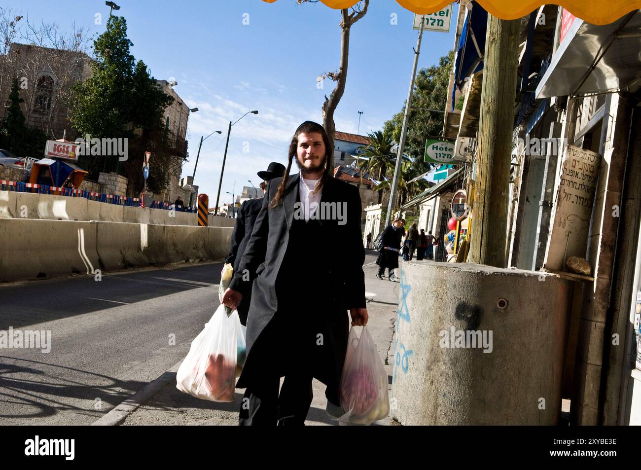 Haredi men walking through the Geula ultra-Orthodox neighborhood in ...