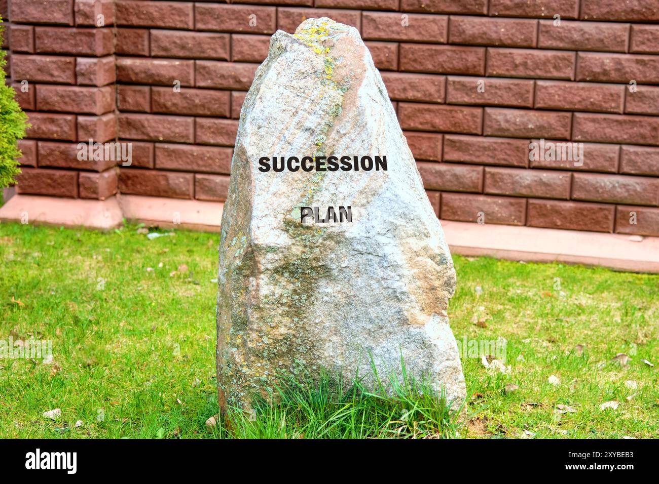 SUCCESSION PLAN word alphabet letters on a stone on the background of a ...