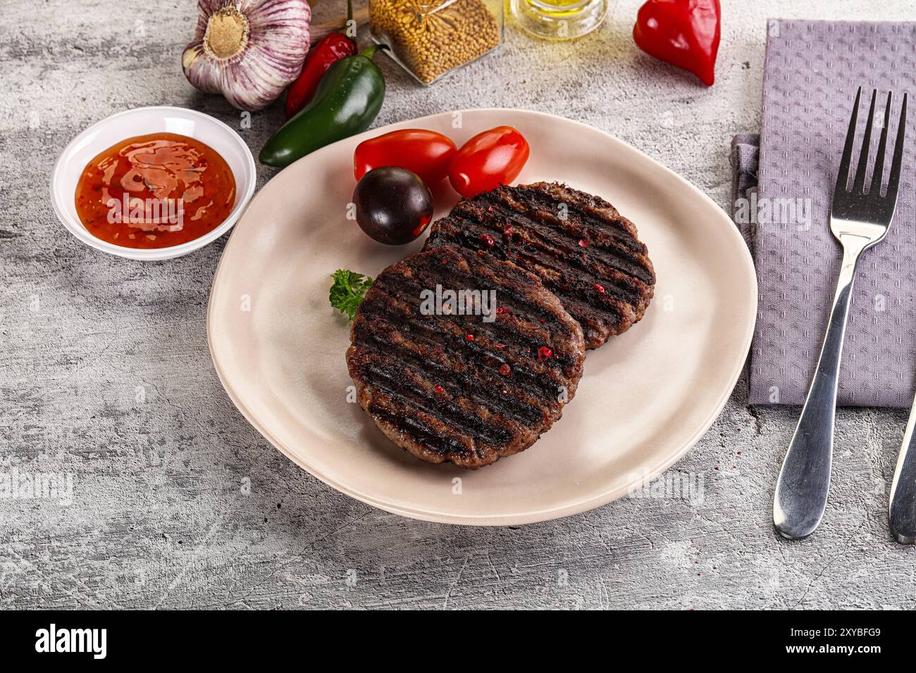 Grilled beef burger cutlet with sauce Stock Photo - Alamy