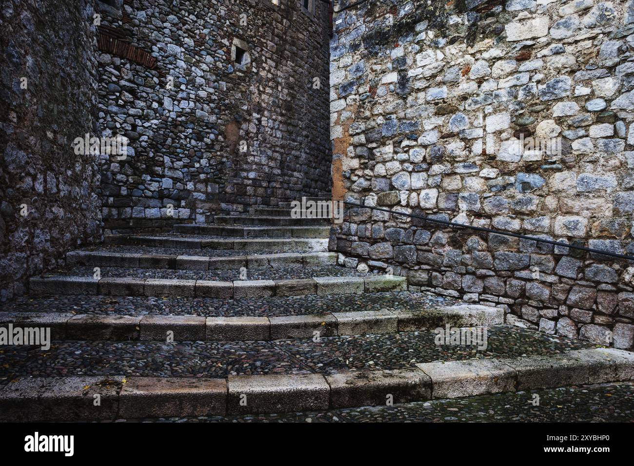 Medieval stone walls and cobblestone stairs in Old Town of Girona city ...