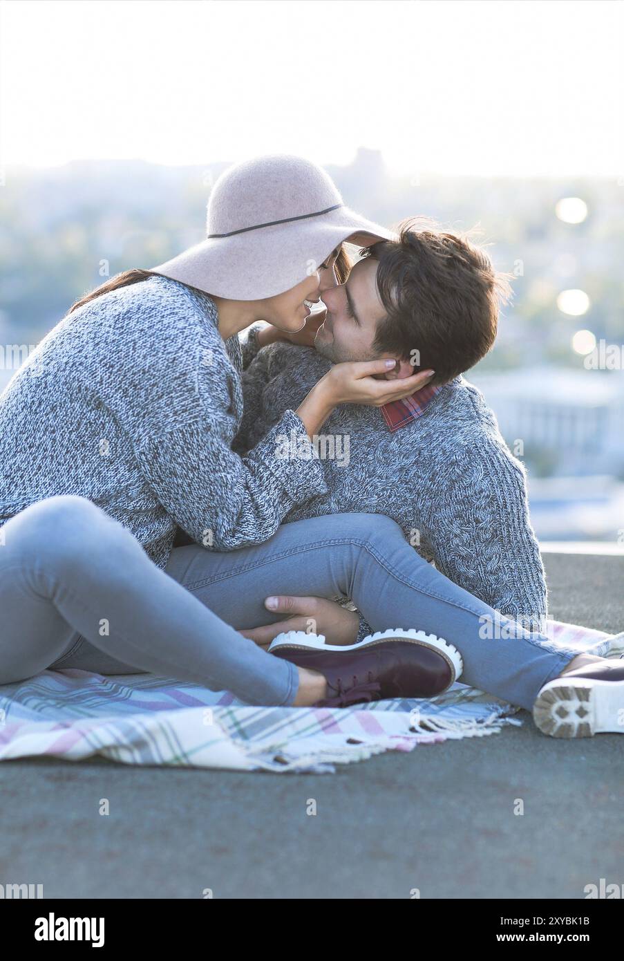 Young man and woman kissing and having fun outdoors Love and relations concept Stock Photo - Alamy
