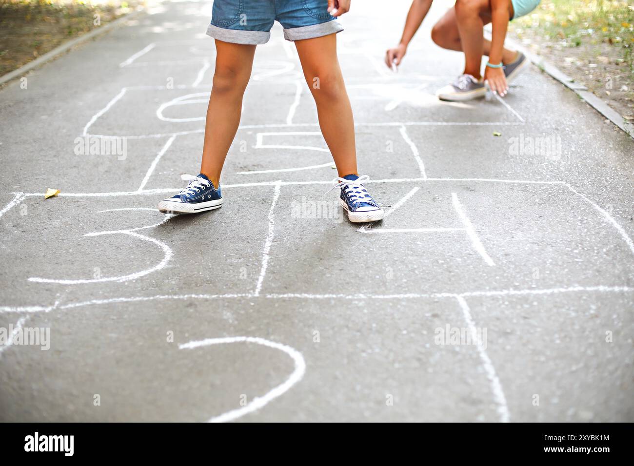 Kid playing hopscotch on playground outdoors, children outdoor ...