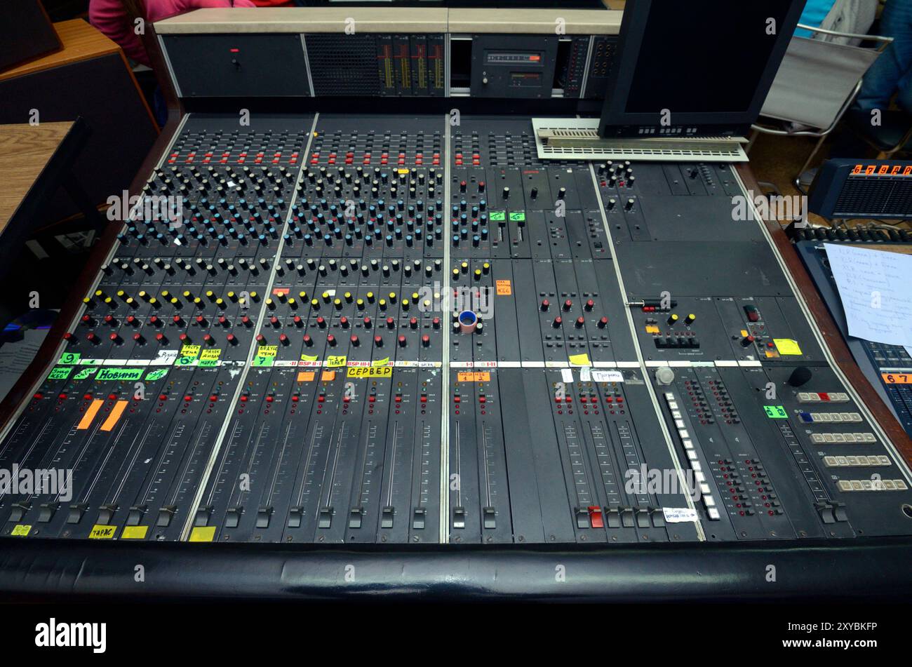 Buttons, levels, switches, speaker volume control on an audio mixer ...