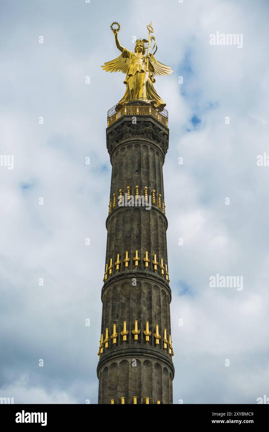 Golden statue of Nike, the goddess of victory, on the Victory Column in ...