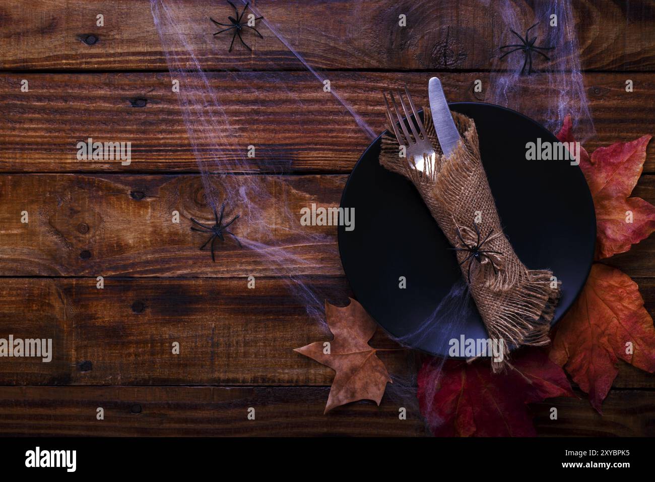 Halloween table setting on old rustic wooden table. Holiday card ...
