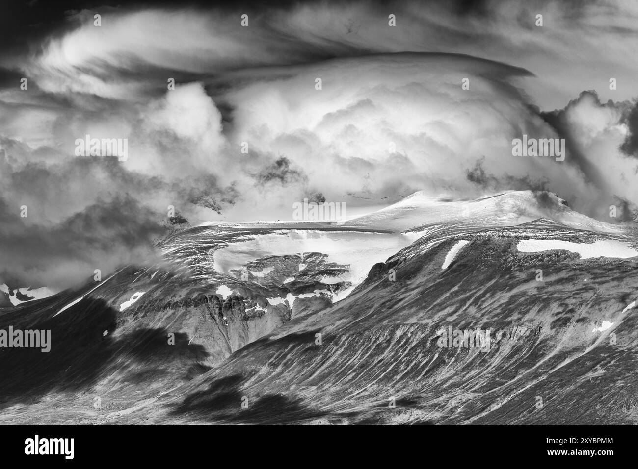 Cloudy mood over the Laddjuvaggi valley and the highest mountain in ...