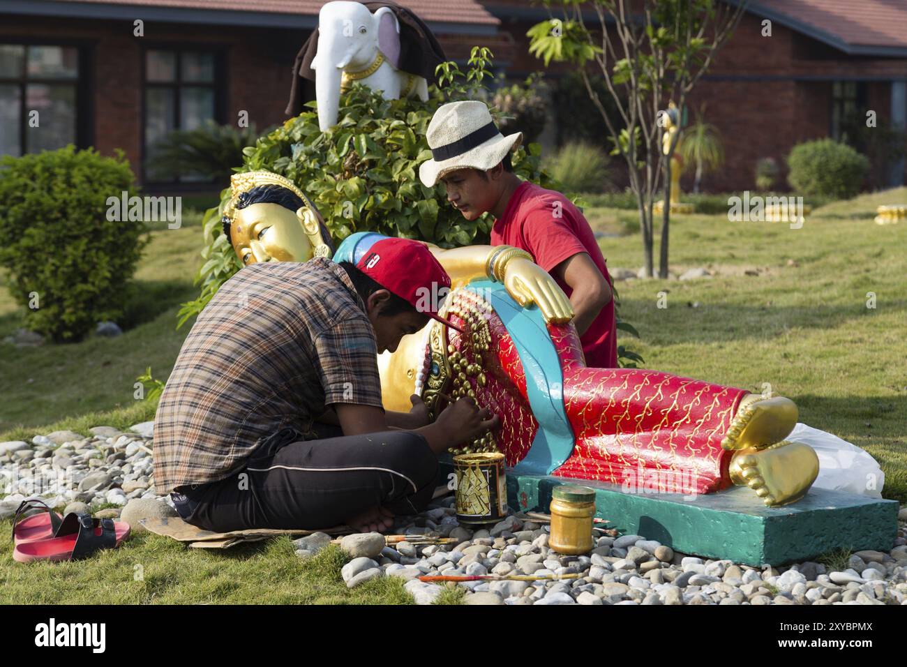 Lumbini, Nepal, November 26, 2014: Photograph of workers restorationg ...