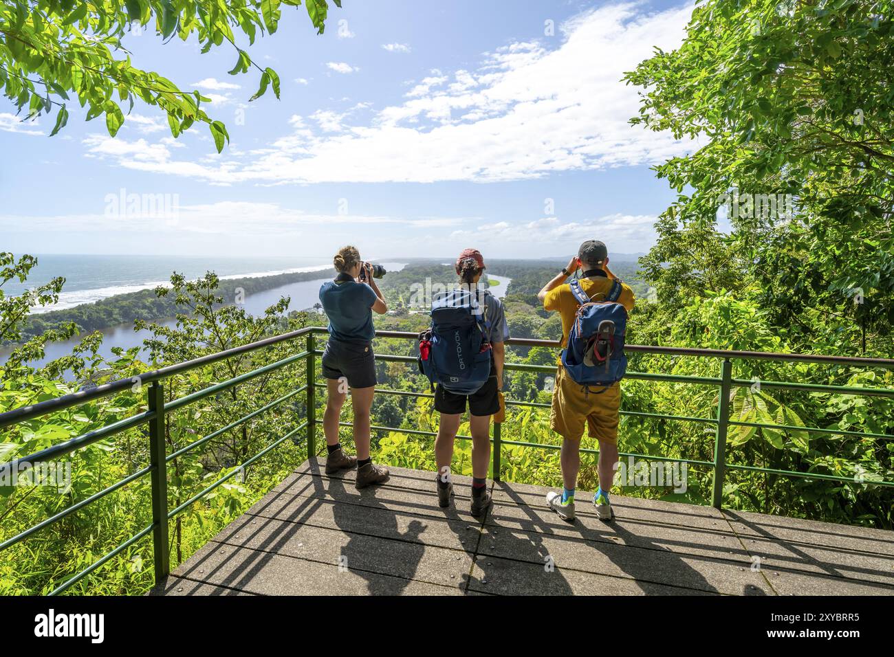 Tourists look out over the rainforest from Cerro Tortuguero, Tortuguero ...