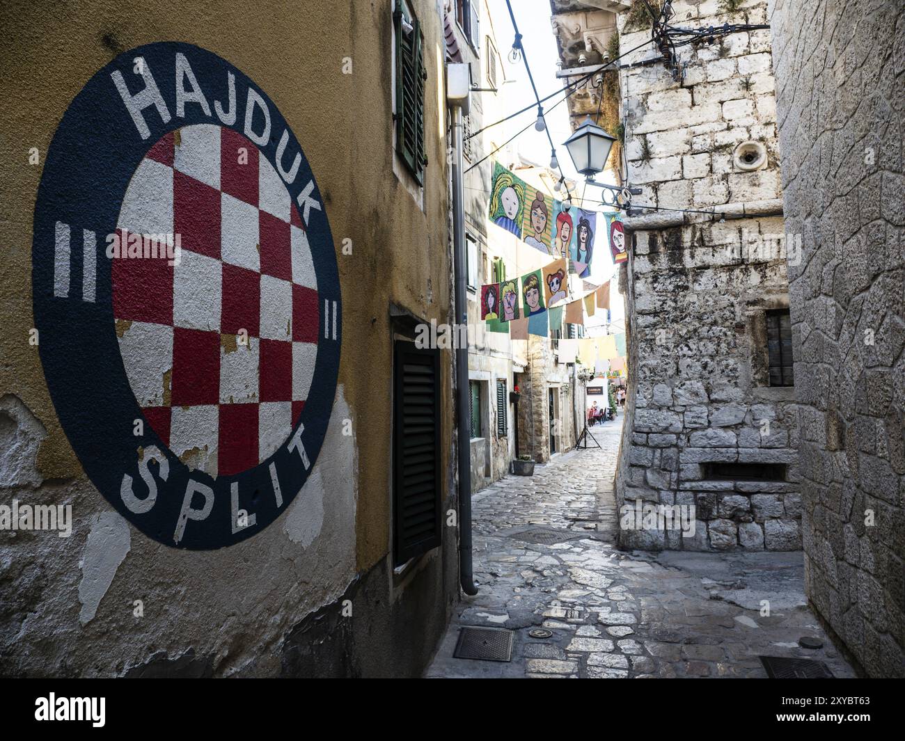 Crest of Haiduk Split football club, alley in the old town centre ...