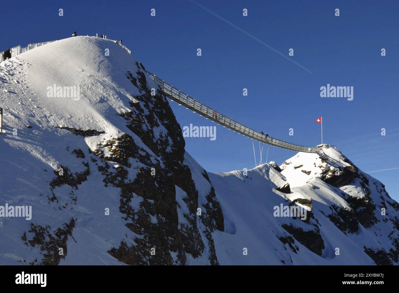 Suspension bridge connesting two mountain peaks Stock Photo - Alamy