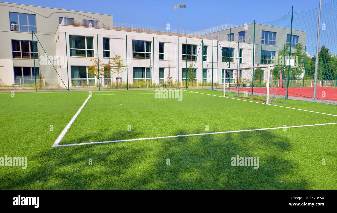 Artificial turf football pitch near school Stock Photo - Alamy