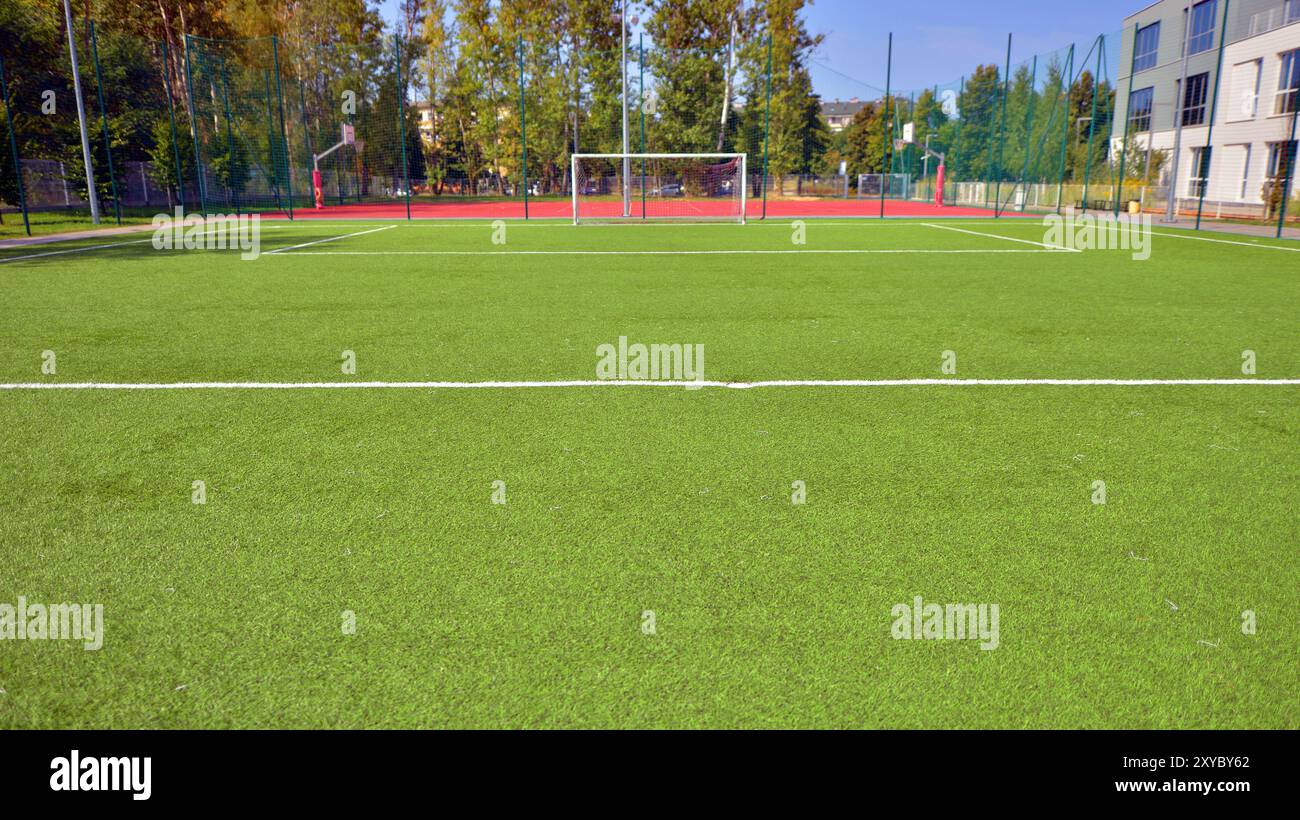 Artificial turf football pitch near school Stock Photo - Alamy