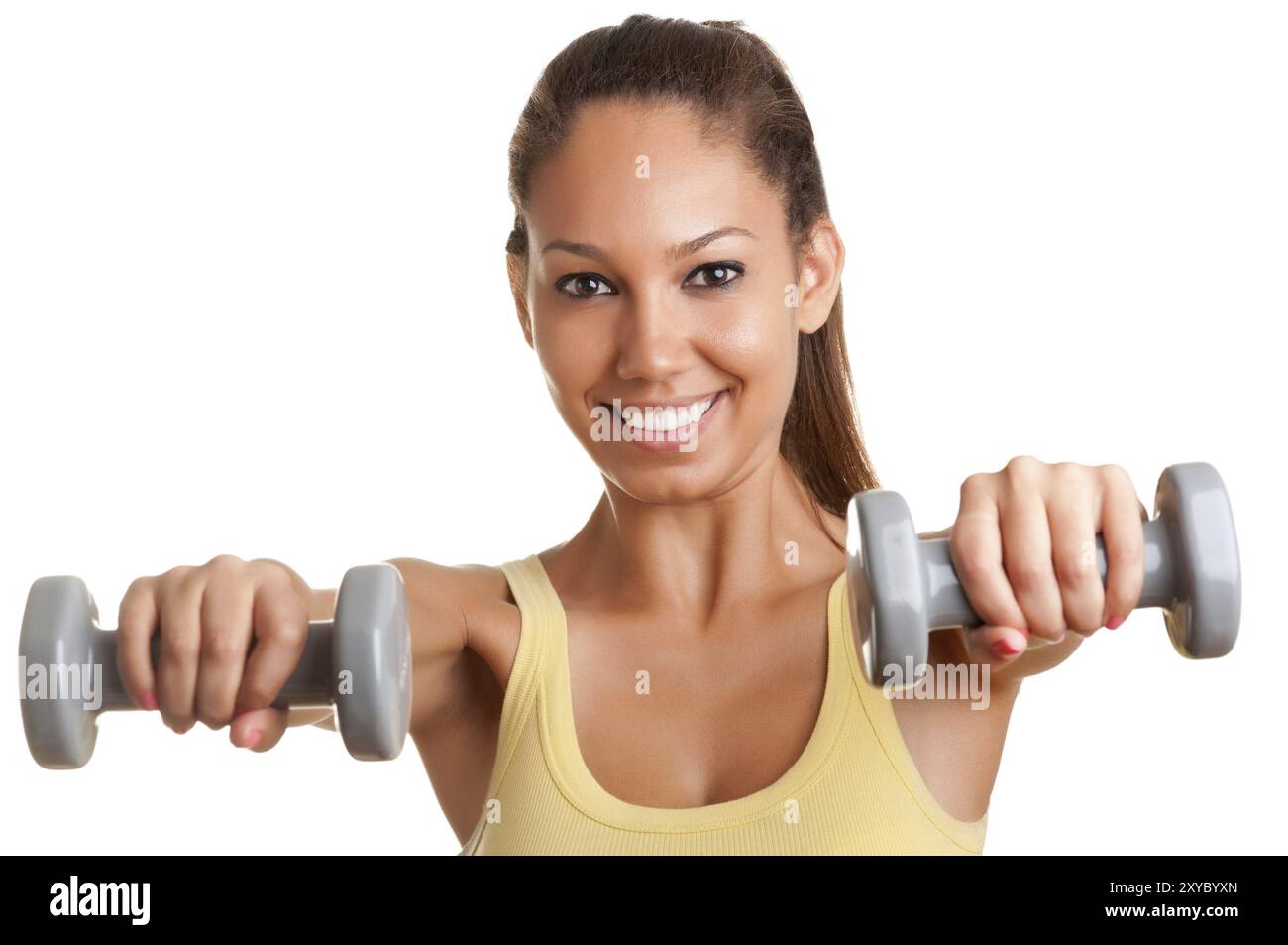 Woman working out with dumbbells at a gym, isolated in a white ...