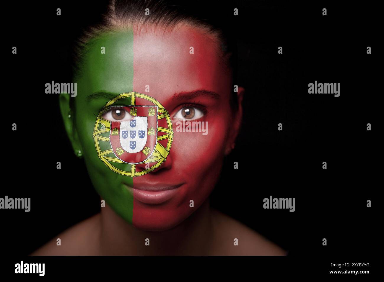 Portrait of a woman with the flag of the Portugal painted on her face ...