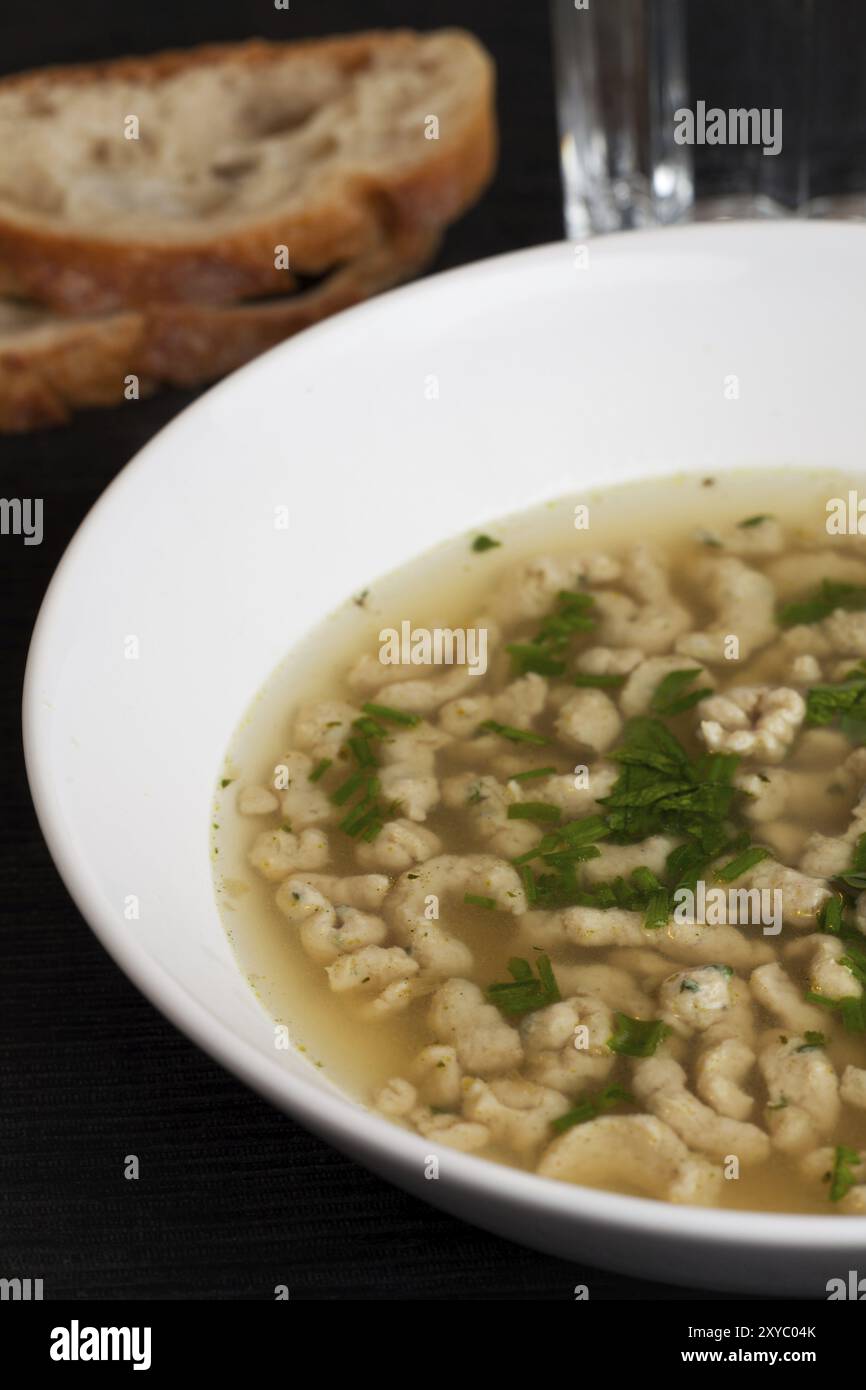 Bavarian fried spaetzle soup with bread Stock Photo - Alamy