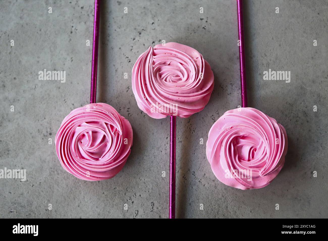Cool sweet meringues in the roses form. Birthday sweets Stock Photo - Alamy