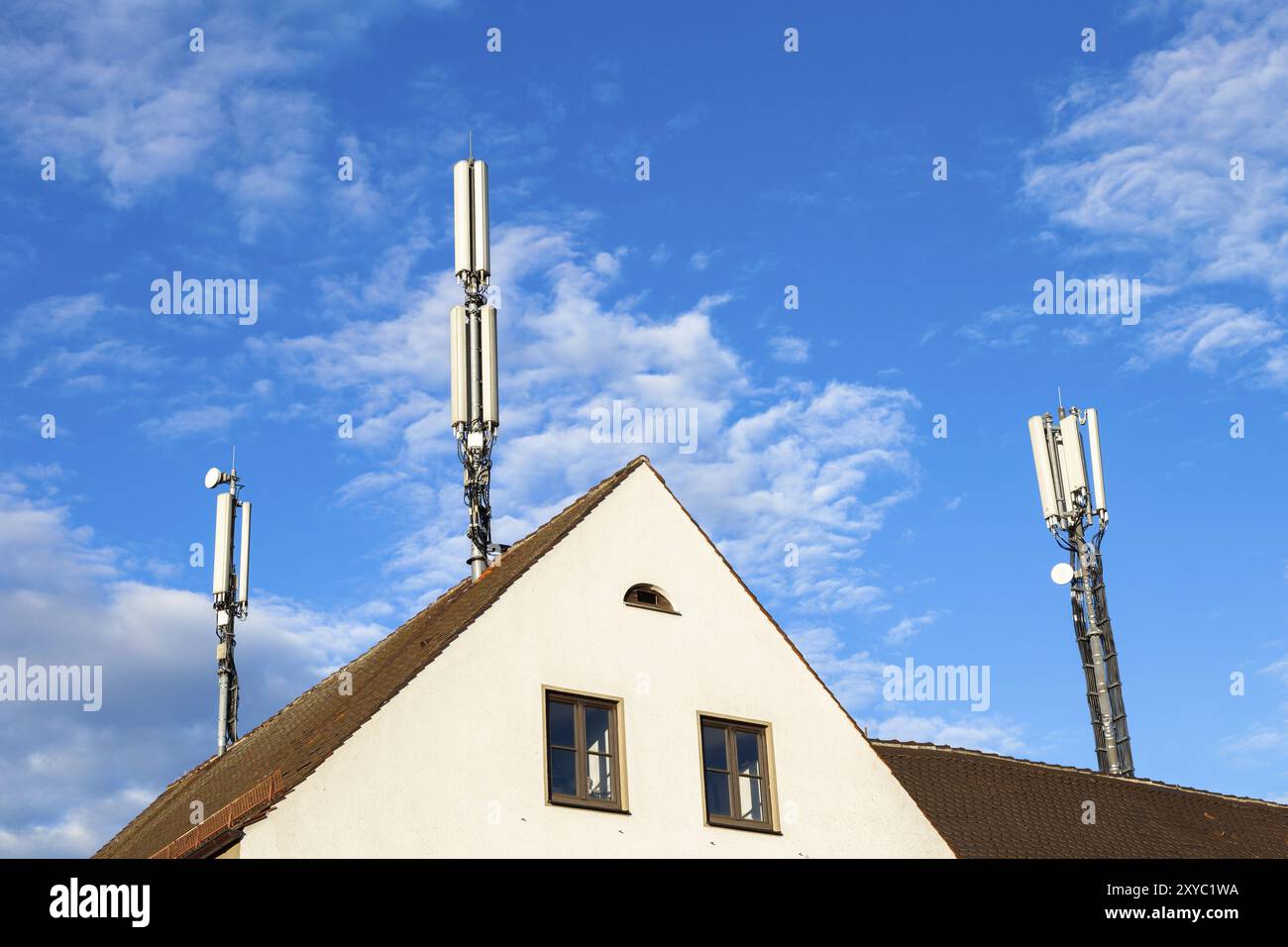 Mobile phone masts on a rooftop in Germany Stock Photo - Alamy