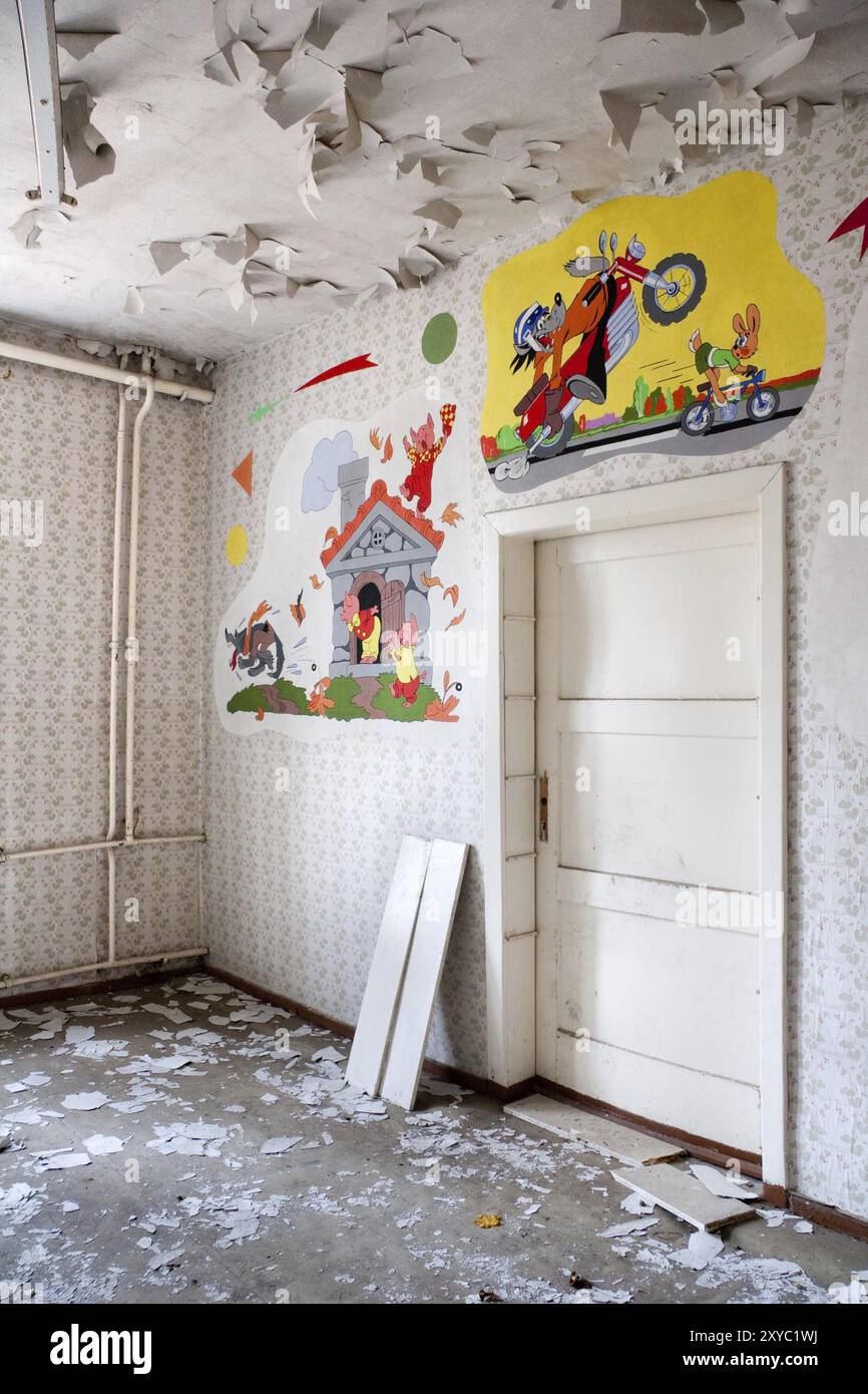 Room of an abandoned former Soviet barracks with old Russian animated ...