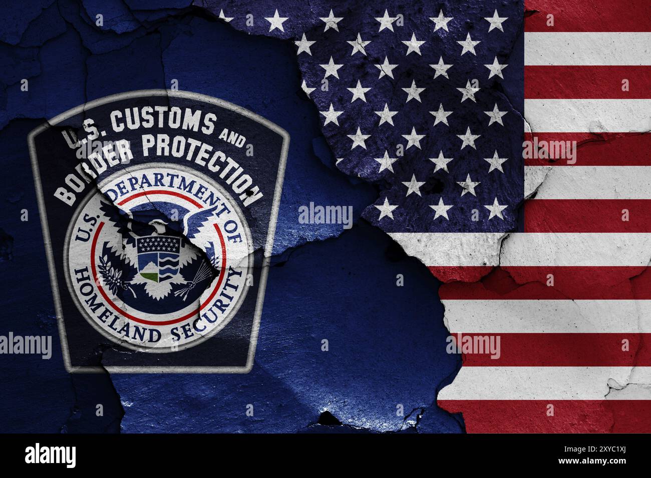 Flags of U.S. Customs and Border Protection and USA painted on cracked ...