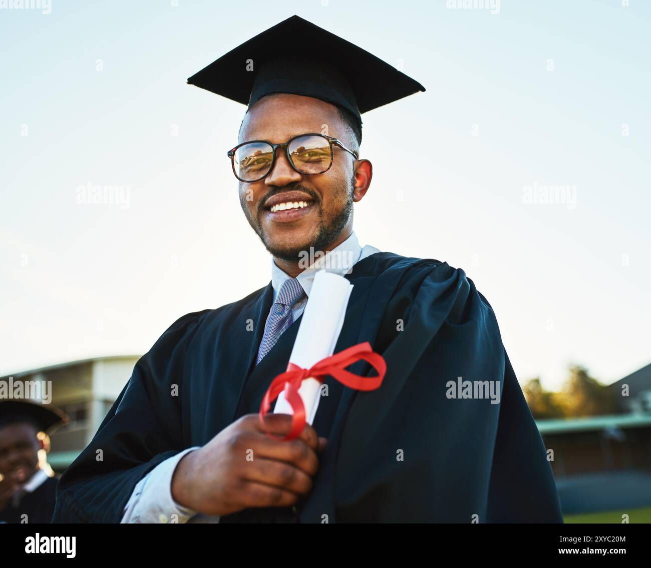 University, black man and portrait with diploma at graduation for ...