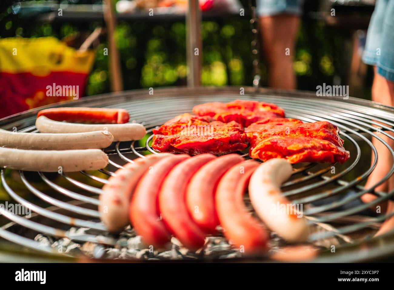 Steak with Sausages Roasting over a Grill Grate During Grill Season ...