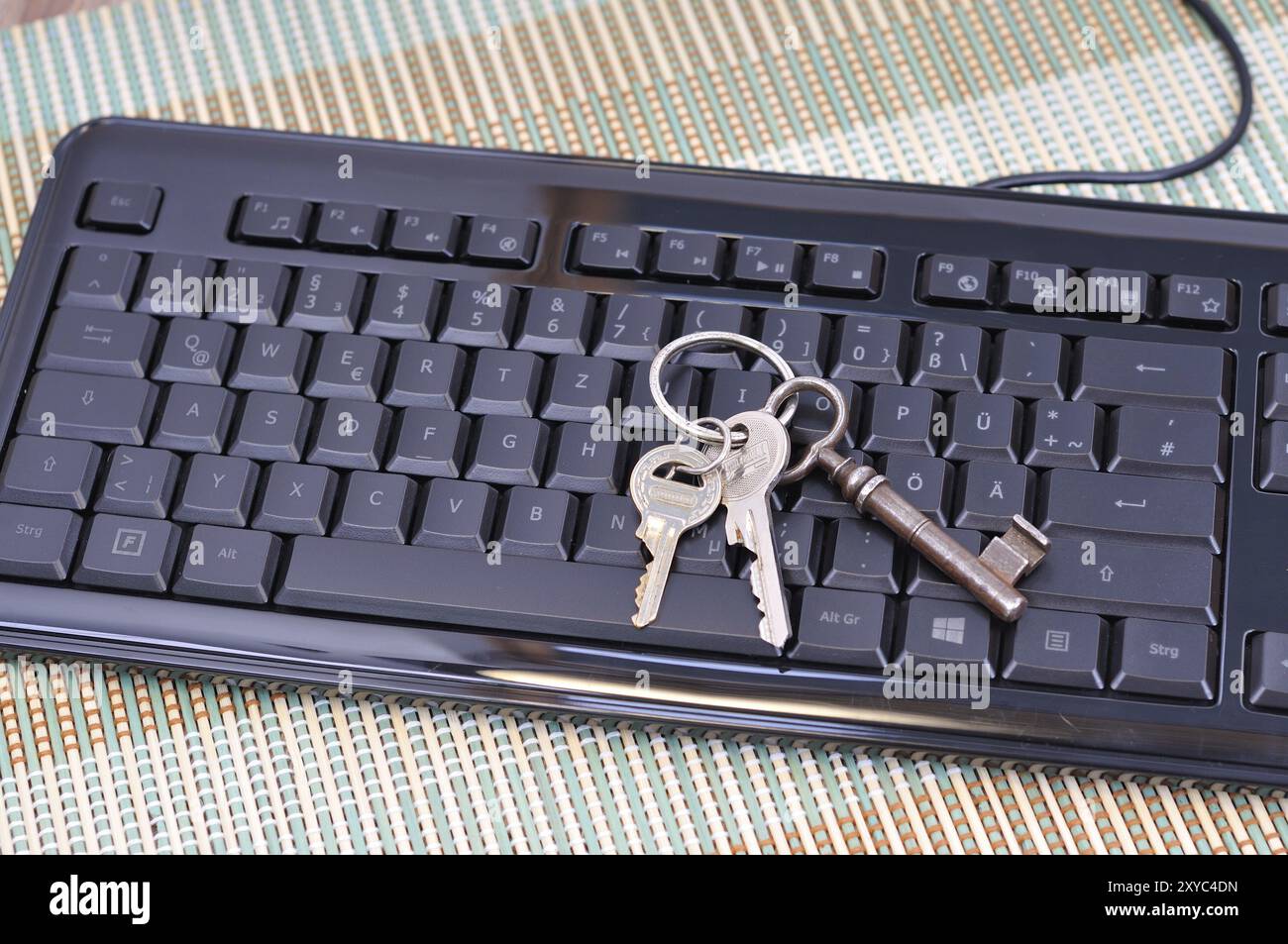 Computer keyboard with a key ring.Computer keyboard with a key ring ...