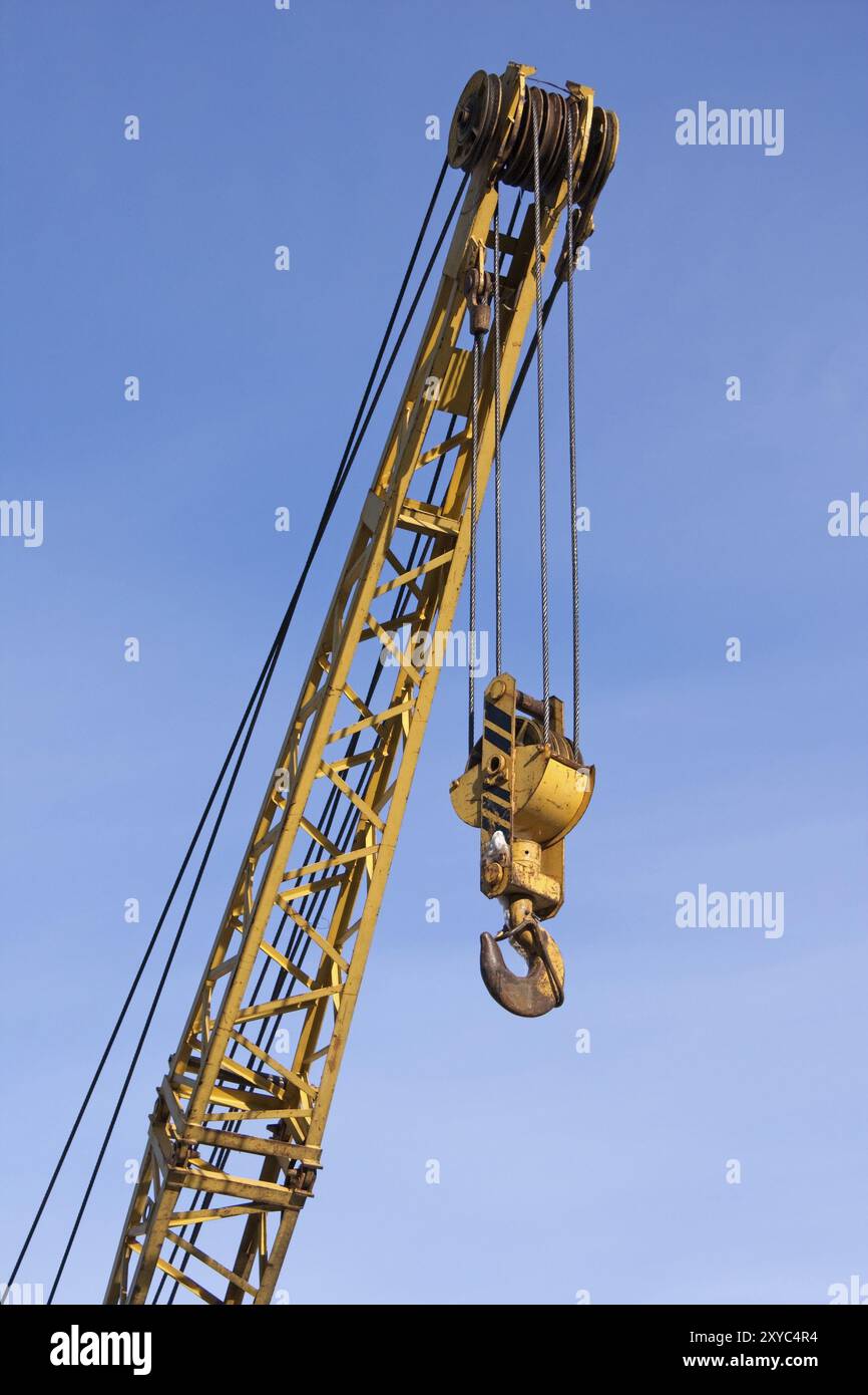 Tower crane with steel hook building metal construction Stock Photo - Alamy