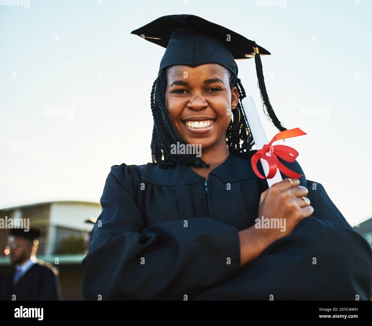Portrait, graduation and happy woman with diploma at college to ...