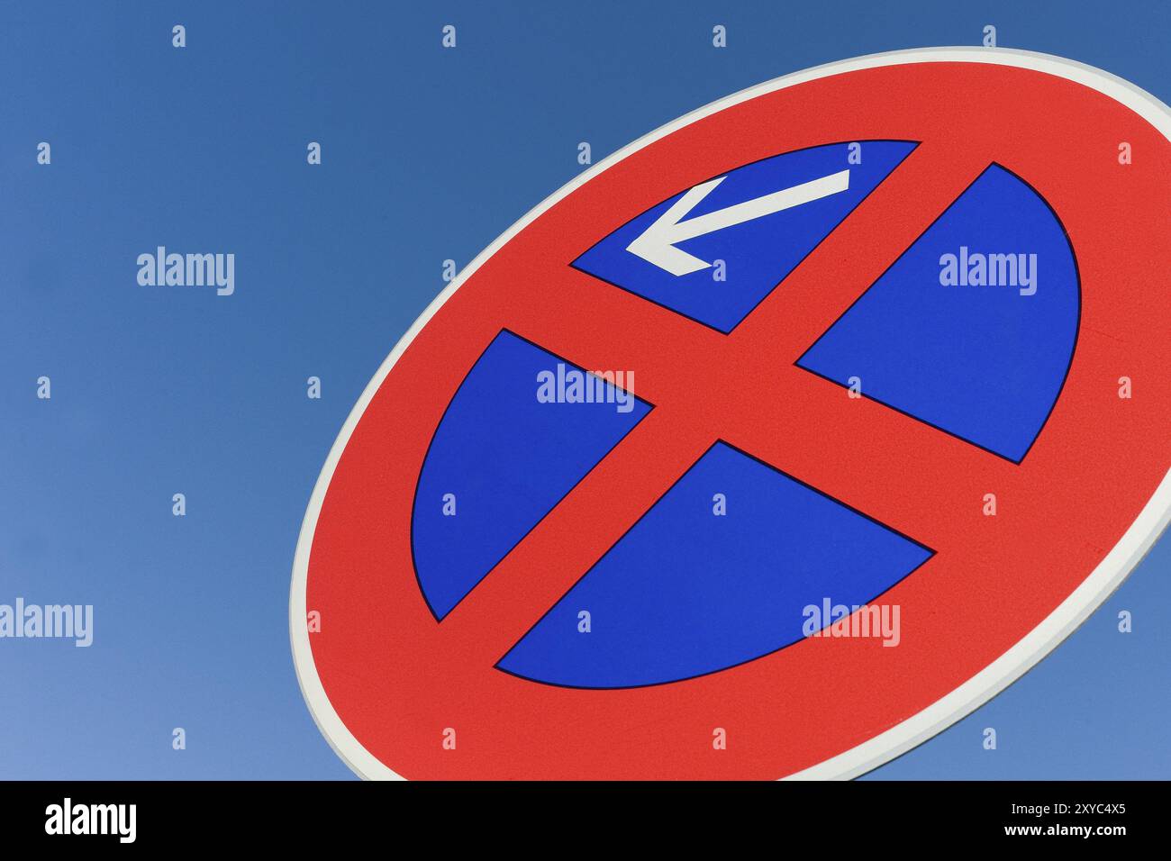 Traffic sign, sign for stopping restriction in front of blue background ...