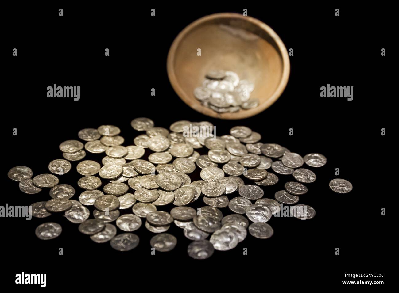 Old antique brown treasure pot with ancient gold and silver coins money ...