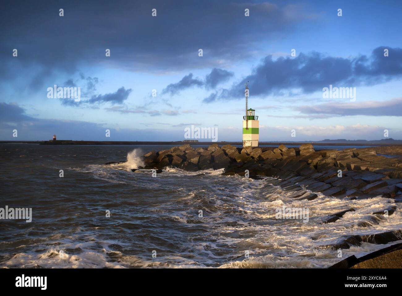 Green lighthouse on North sea, Ijmuiden before sunset Stock Photo - Alamy
