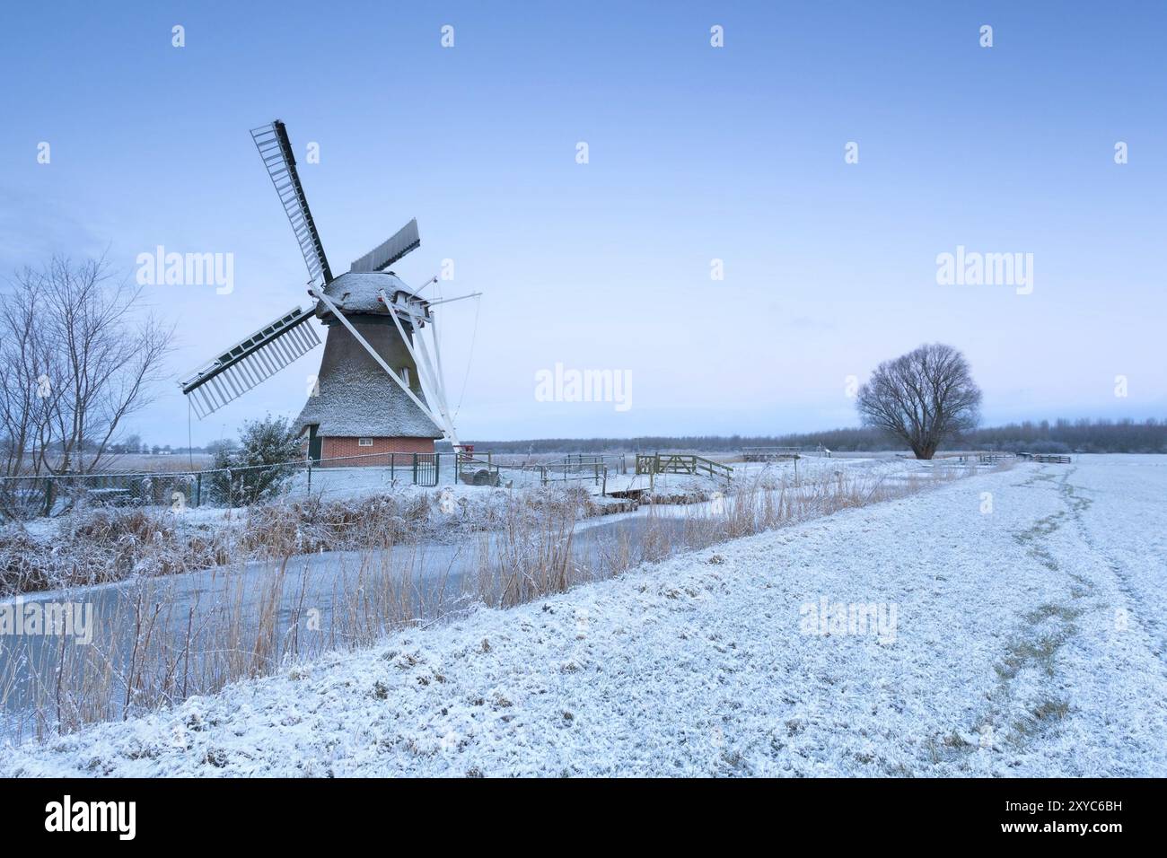 Dutch windmill over river waters hi-res stock photography and images - Alamy