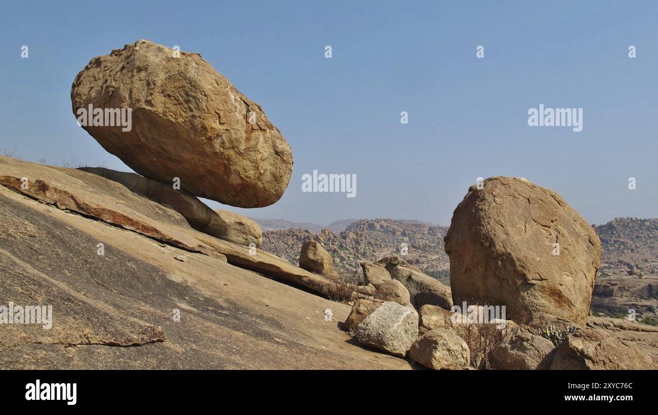 Big balancing granite boulder in Hampi, India. Popular region for rock ...