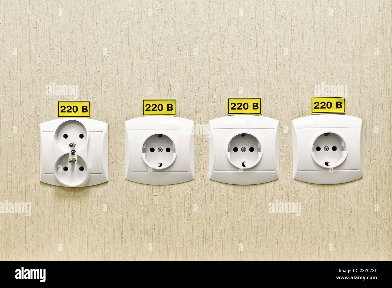 Plug socket 220 volt on the wall of the office premises Stock Photo - Alamy