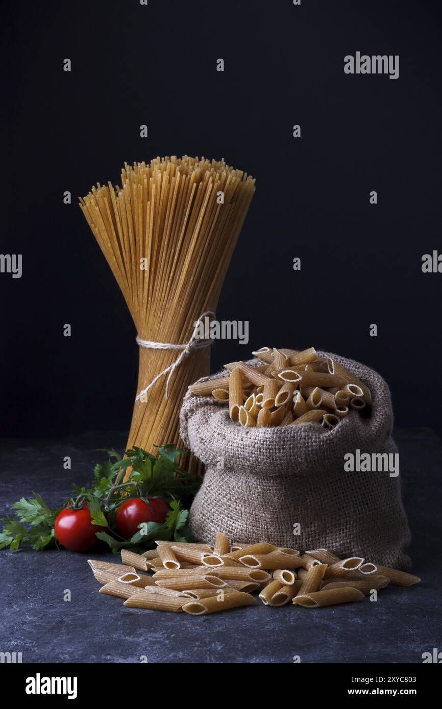 Whole grain dried pasta spaghetti for healthy eating, low key, dark ...