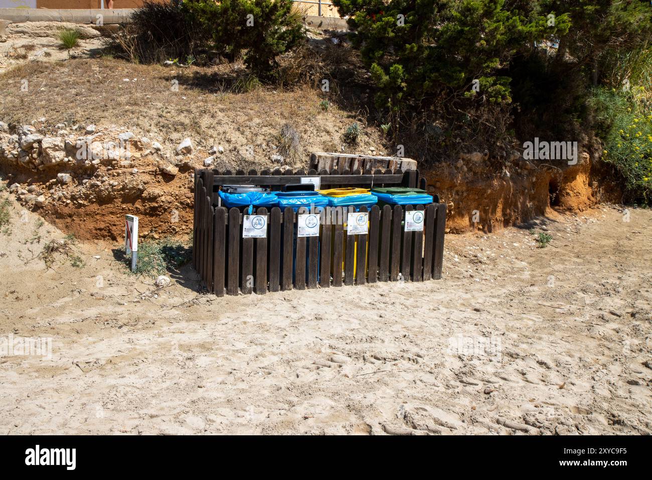 A selection of recycle bins on the beach in the Spanish Island of Ibiza ...