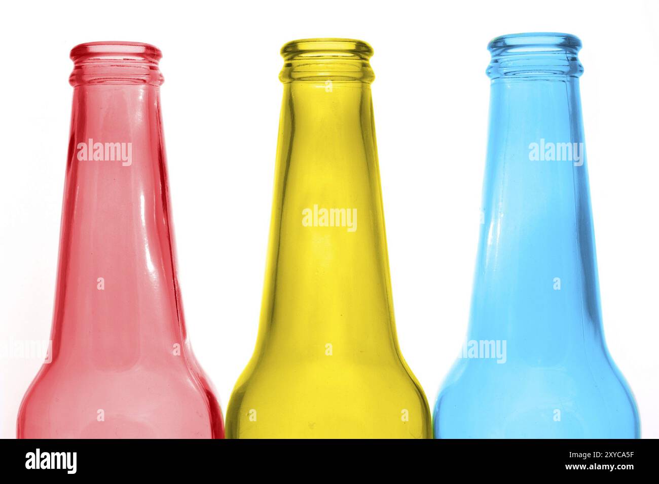 Three multicolored bottles isolated on white Stock Photo - Alamy