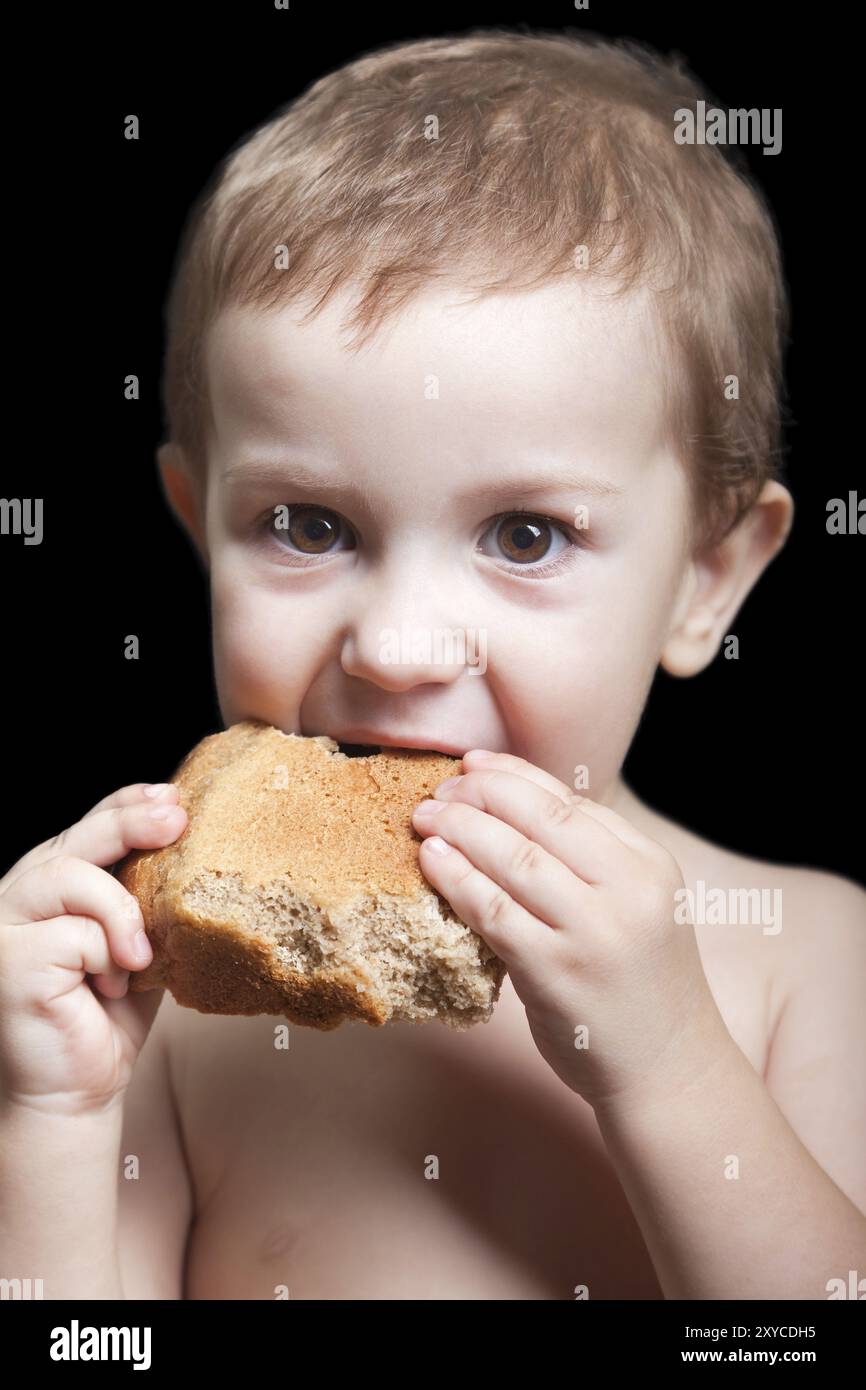 Poor child eating bread hi-res stock photography and images - Alamy
